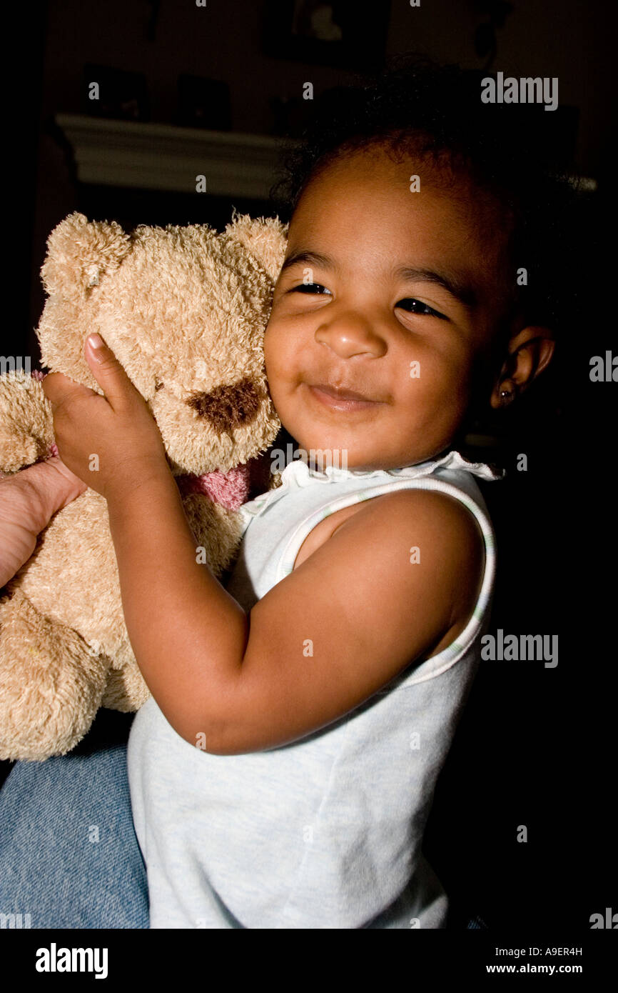 Cute African American Toddler holding her Teddy Bear Stock Photo - Alamy