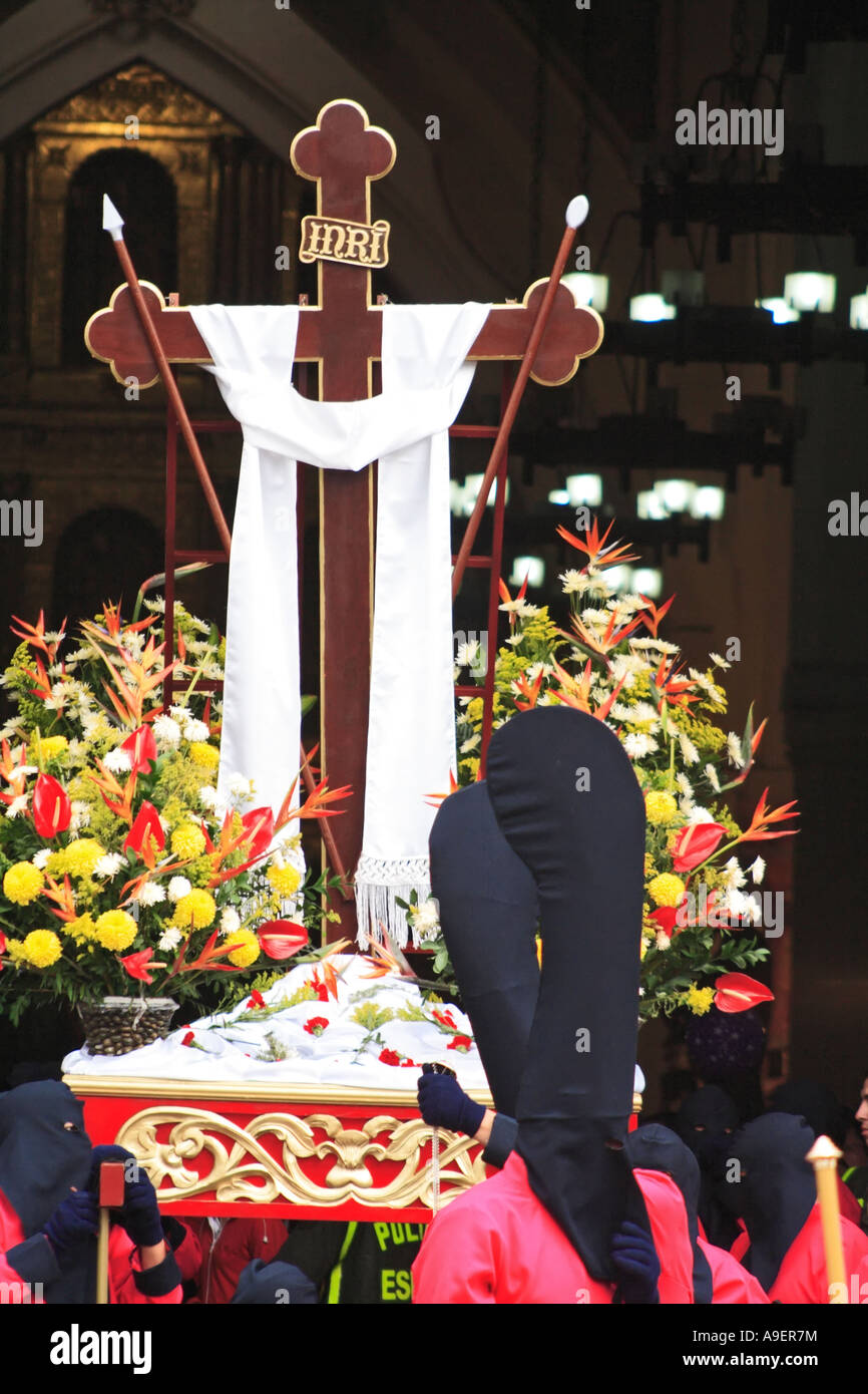 Group of men in penitence costume carrying a traditional religious ...