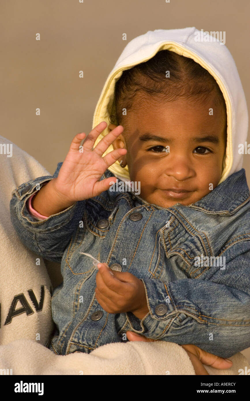 Cute Young Girl waving Stock Photo - Alamy