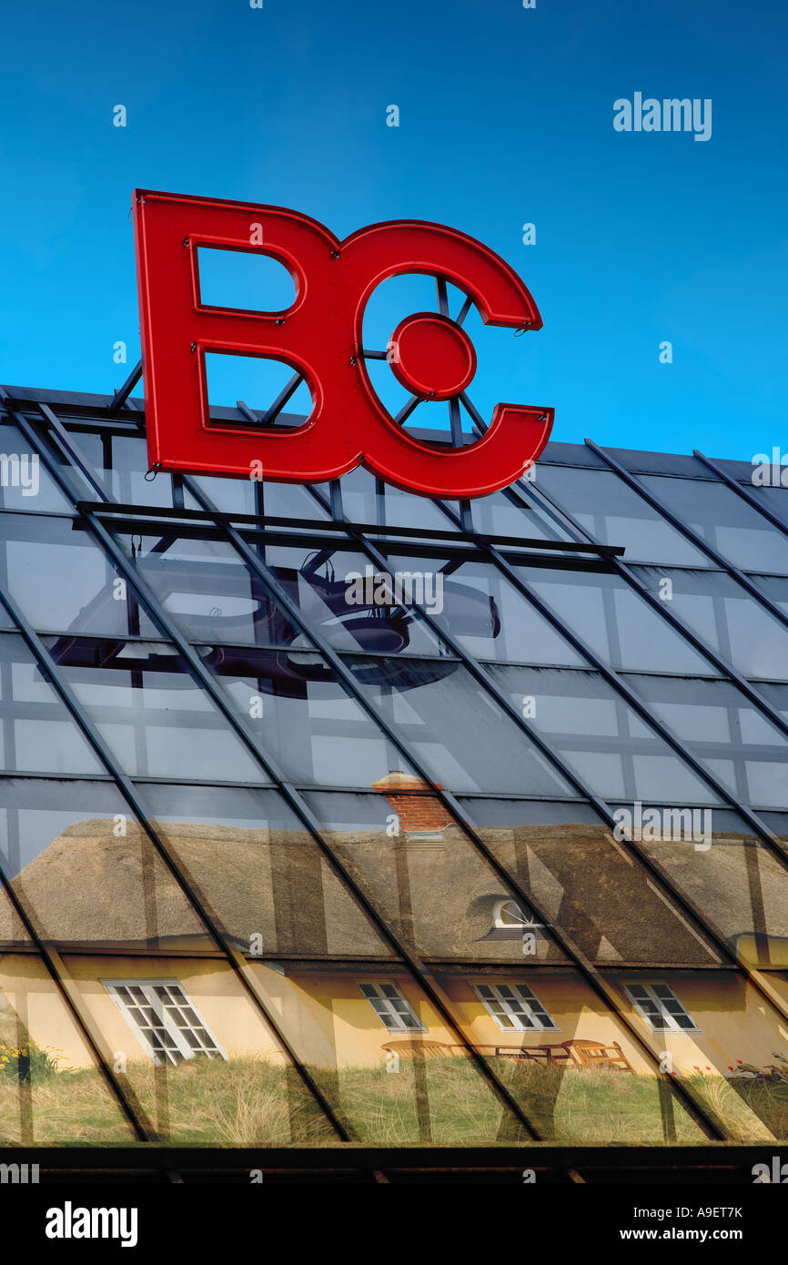 Old thatched house reflecting in modern glass building Stock Photo - Alamy