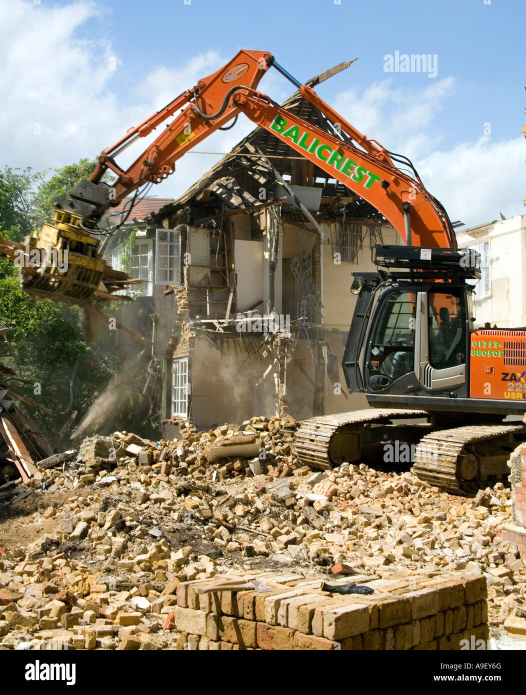 Demolishing a large house in west London to clear the site before ...