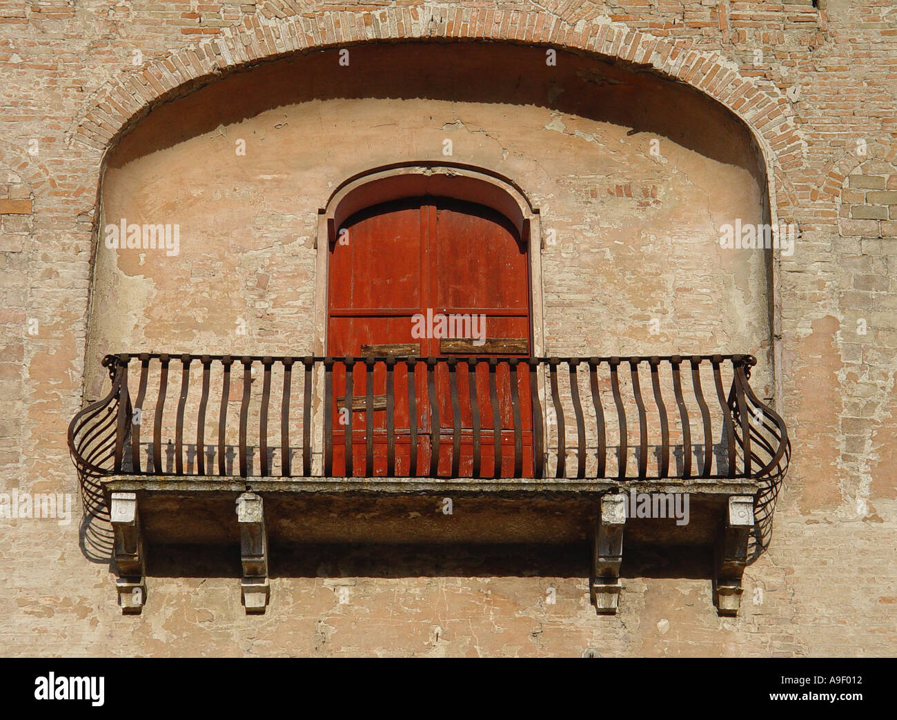 Middle age castle balcony with red wooden door Stock Photo - Alamy