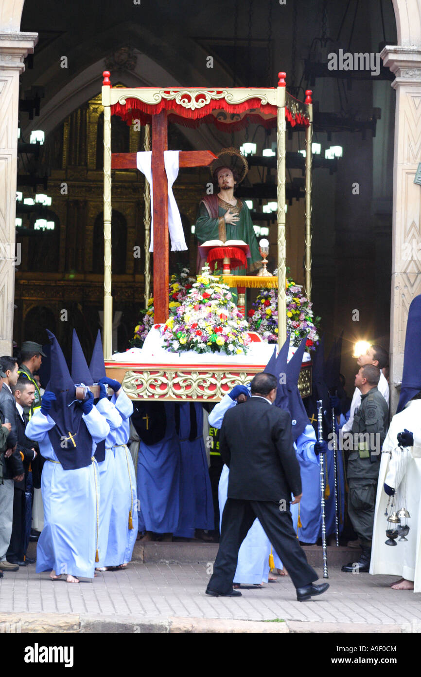 Group of men in penitence costume carrying a traditional religious ...