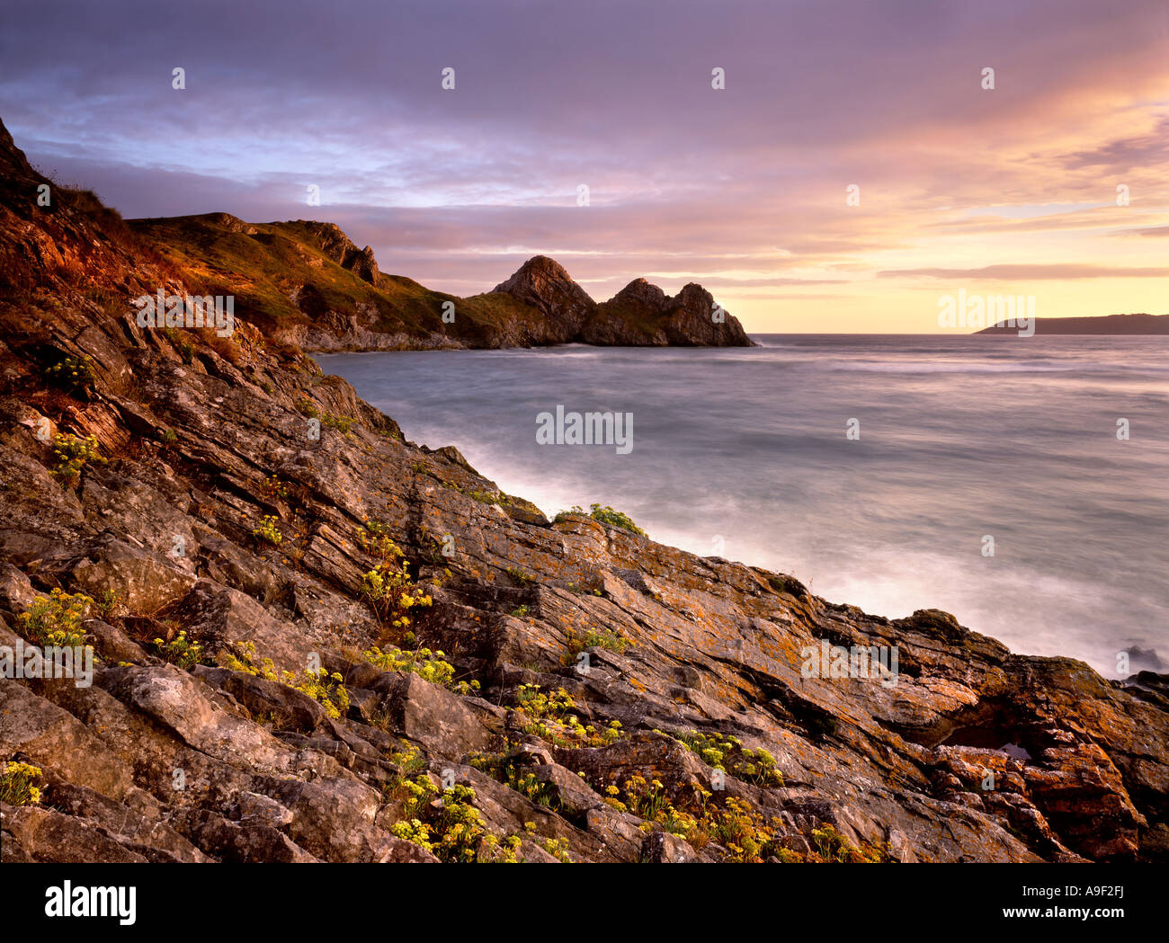 Sunset Three Cliffs Bay Gower Stock Photo - Alamy