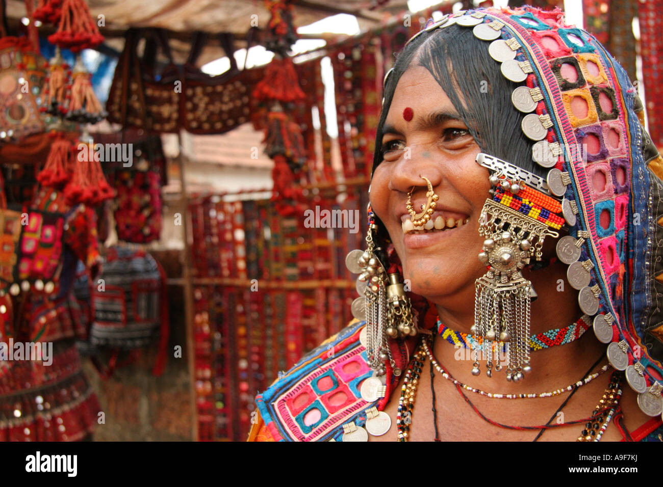 Local Indian market stall vendor at the flea market in Anjuna, Southern ...