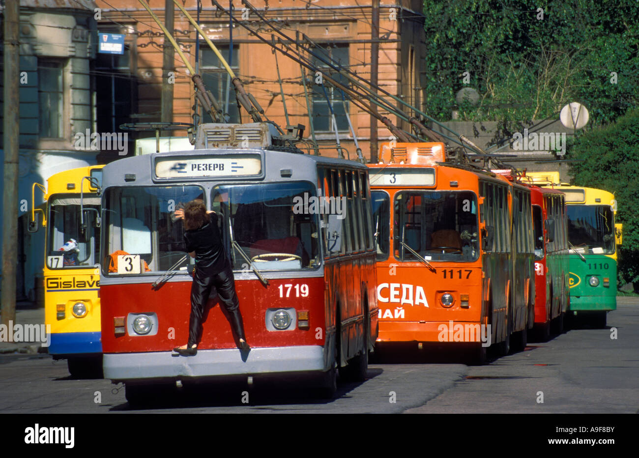 Russia St Petersburg a female bus driver cleaning the windows of her ...