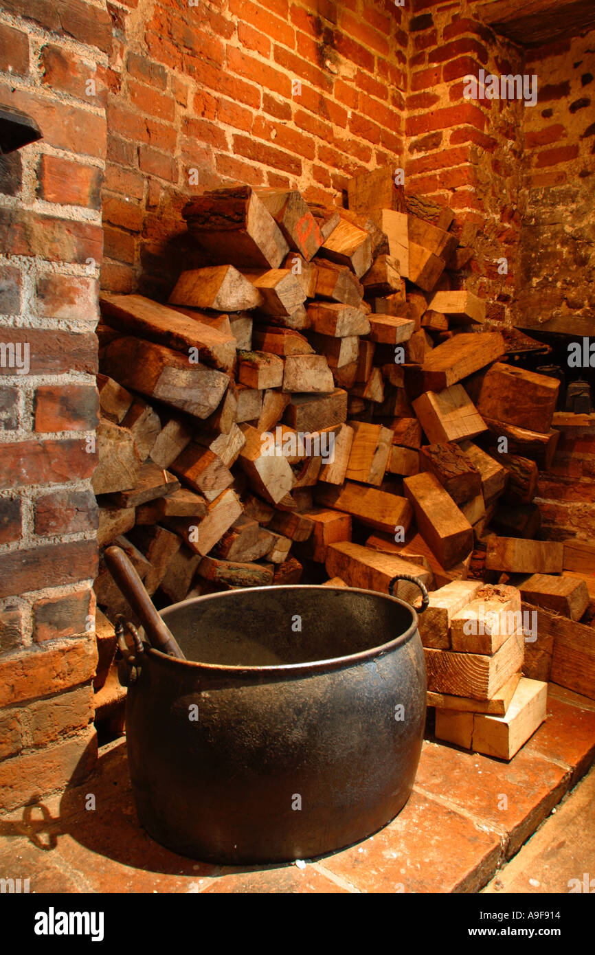 Traditional hearth with logs from the wood store Stock Photo - Alamy