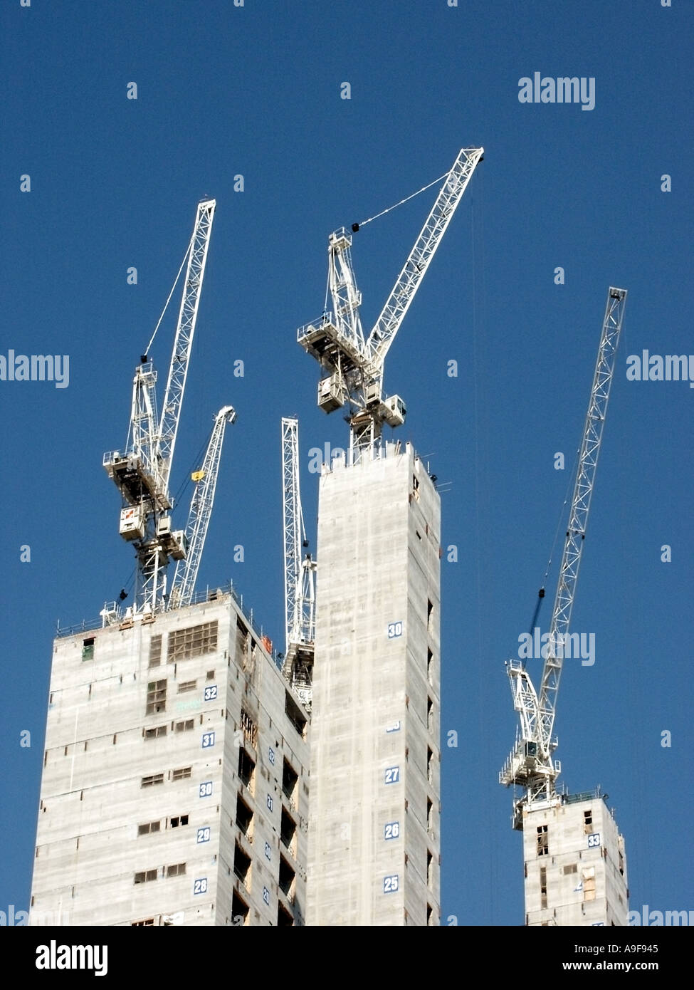 Work in progress concrete core of new offices under construction cranes ...