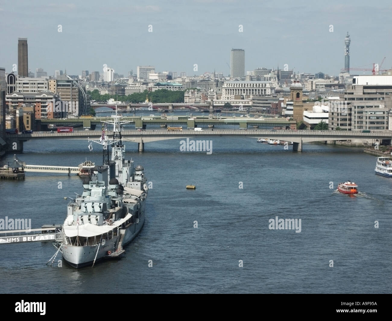 Aerial view looking down on River Thames bridges & HMS Belfast light ...