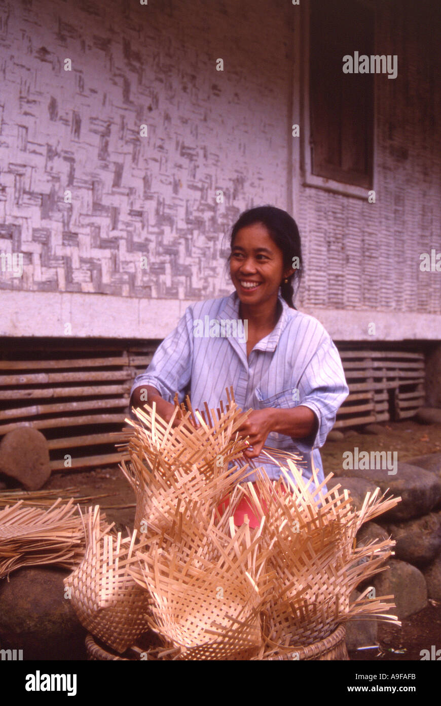 Indonesia West Java A Baduy girl making baskets Stock Photo - Alamy