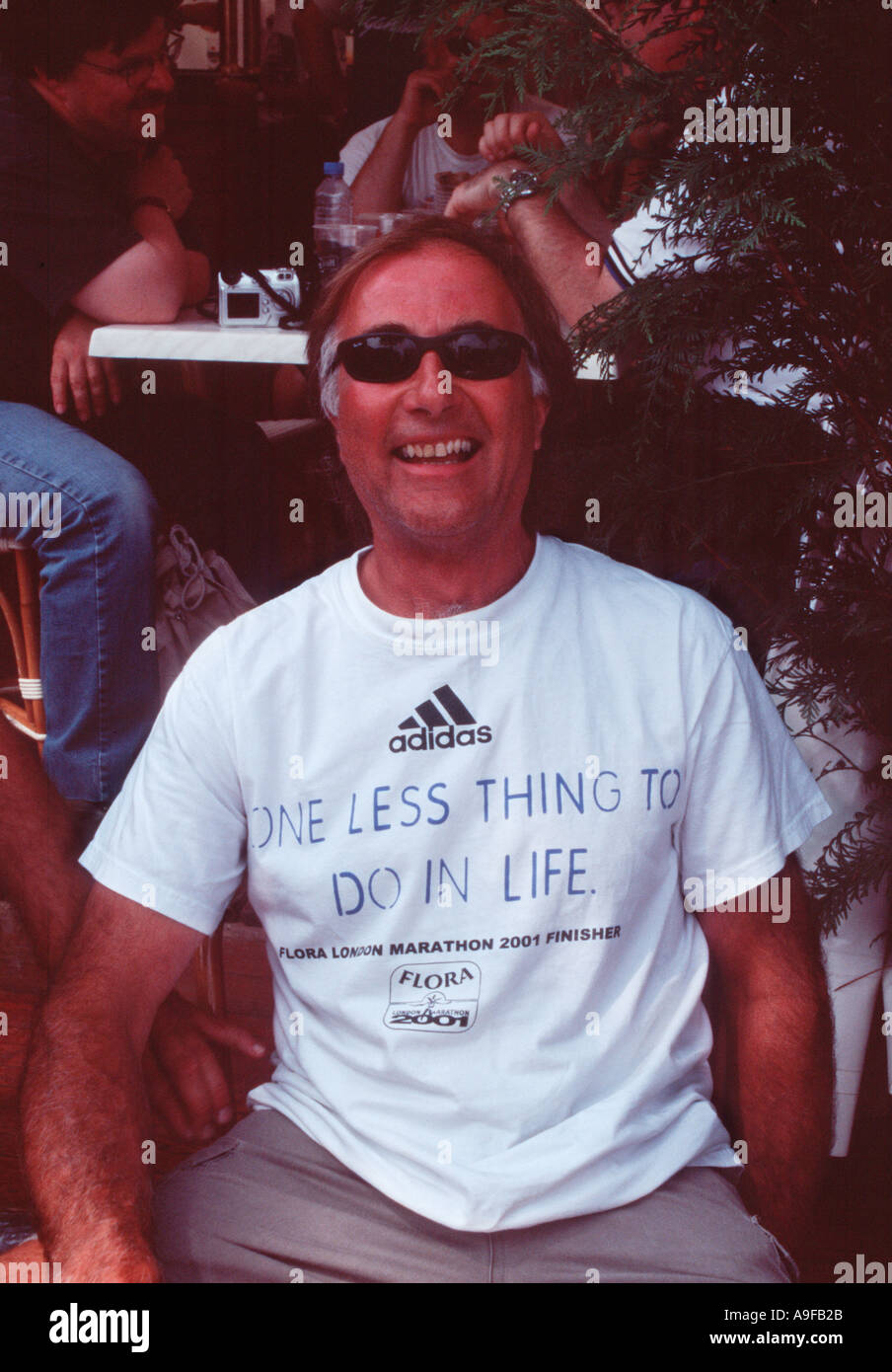 Man wearing a tee shirt that says One less thing to do in life Stock ...