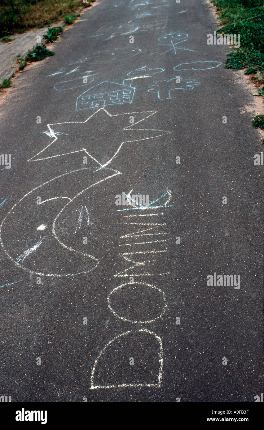 Chalk drawings by children on an asphalt path Stock Photo - Alamy