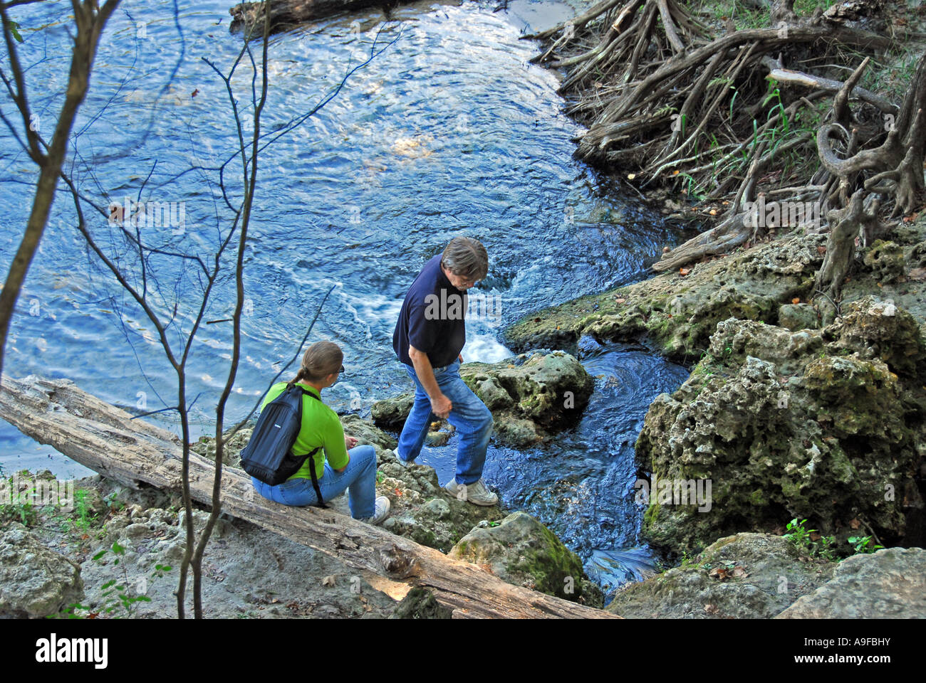 Suwannee River State Park Florida hikers resting by small waterfall ...