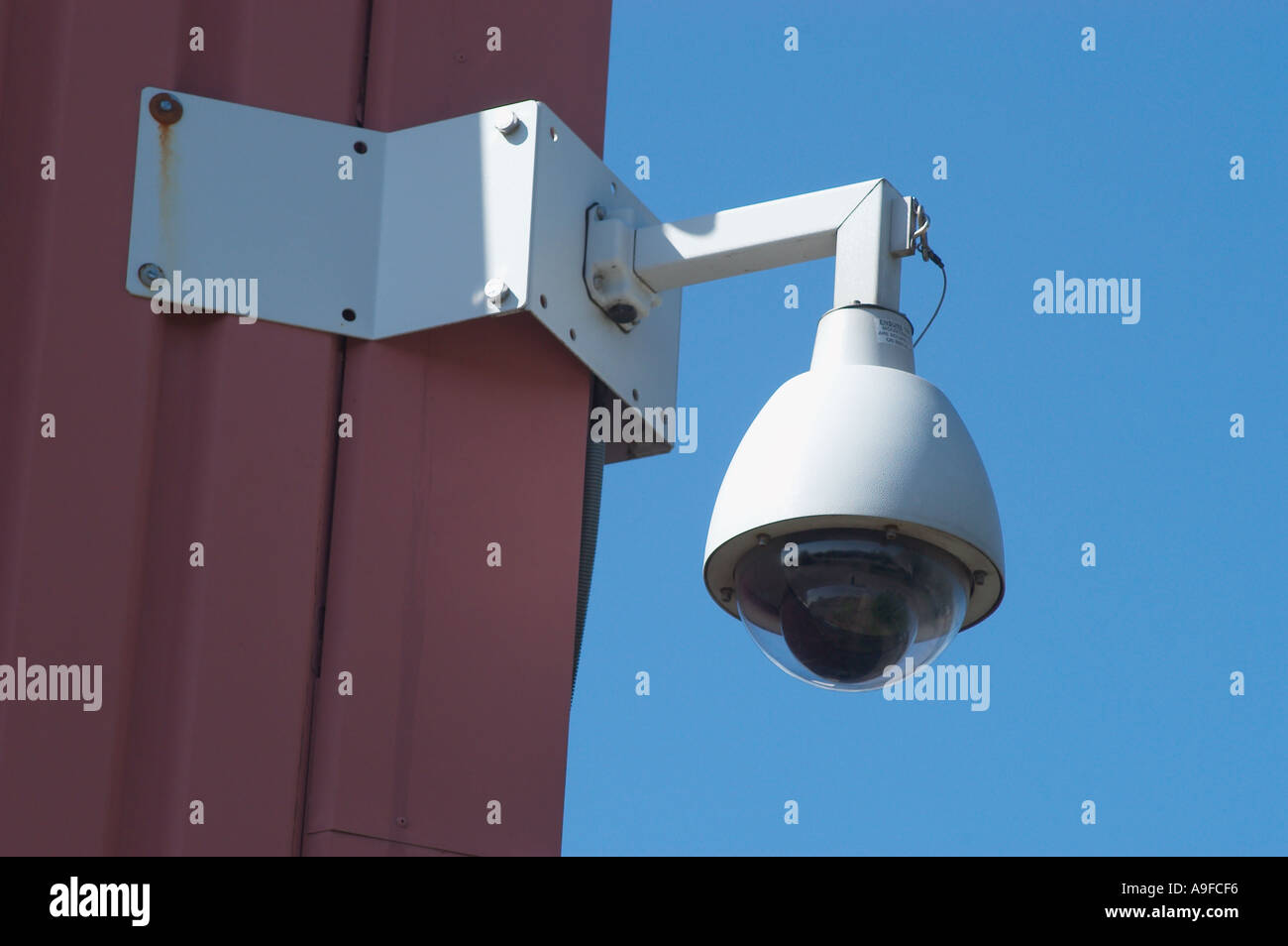 Revolving CCTV Security Camera in Housing Stock Photo - Alamy