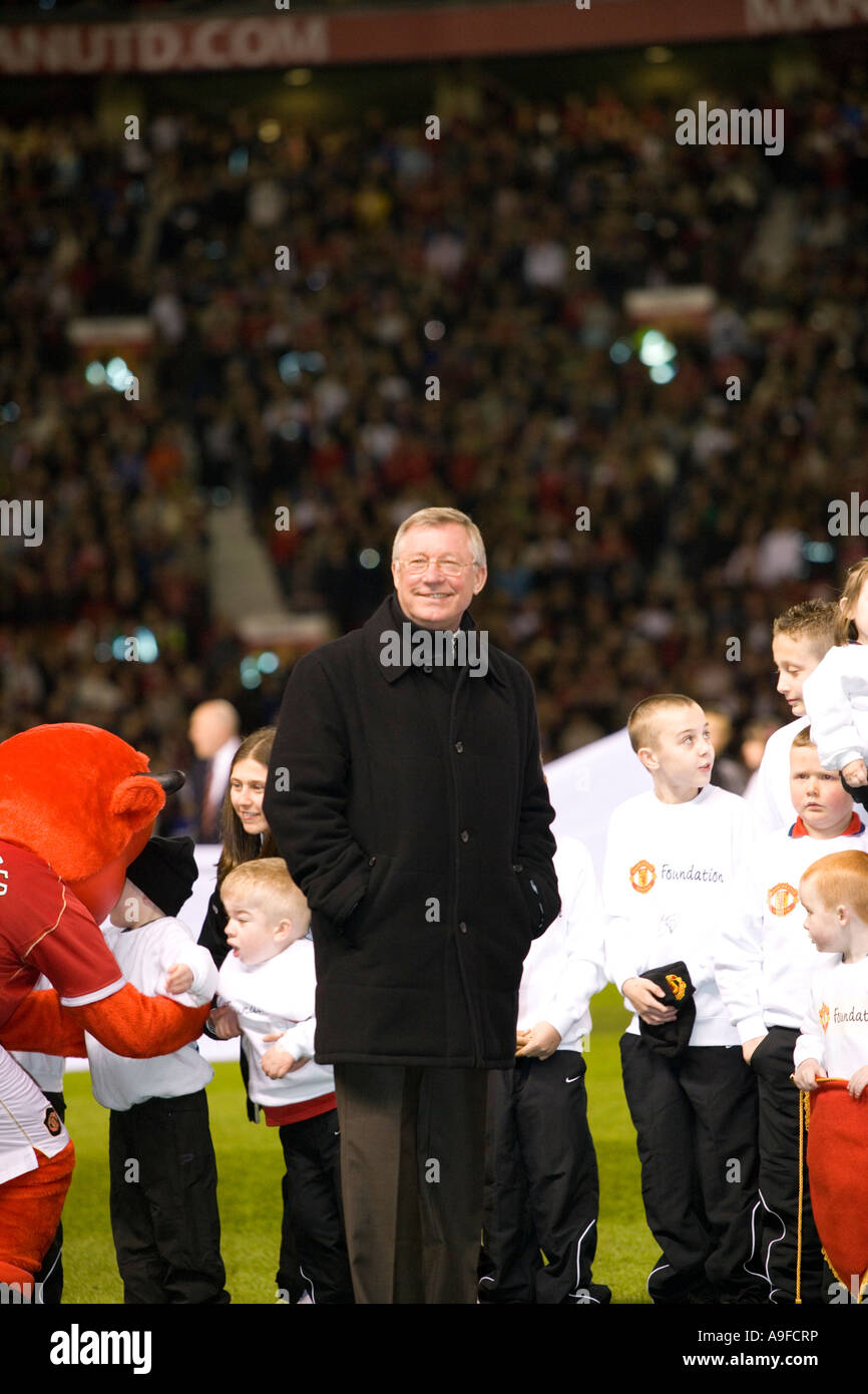 Sir Alex Ferguson on the pitch at Old Trafford Stock Photo - Alamy