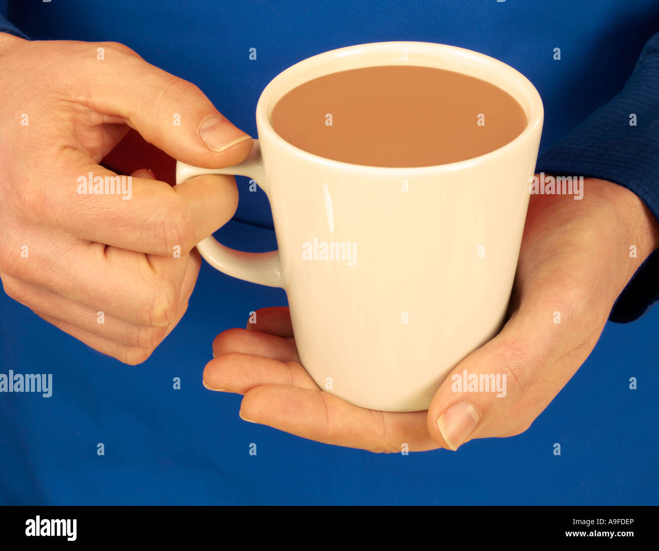 MAN WITH HOT CHOCOLATE Stock Photo - Alamy