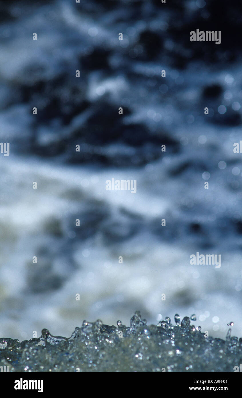 Water drops in front of frothing water Stock Photo - Alamy