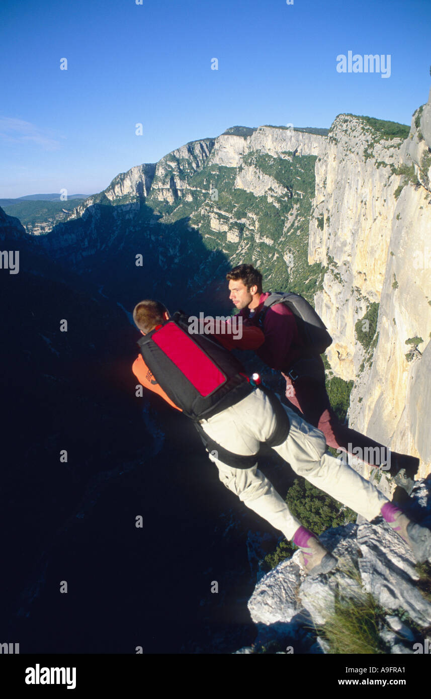 base jumping, two base jumpers launching from cliff into abyss, France ...