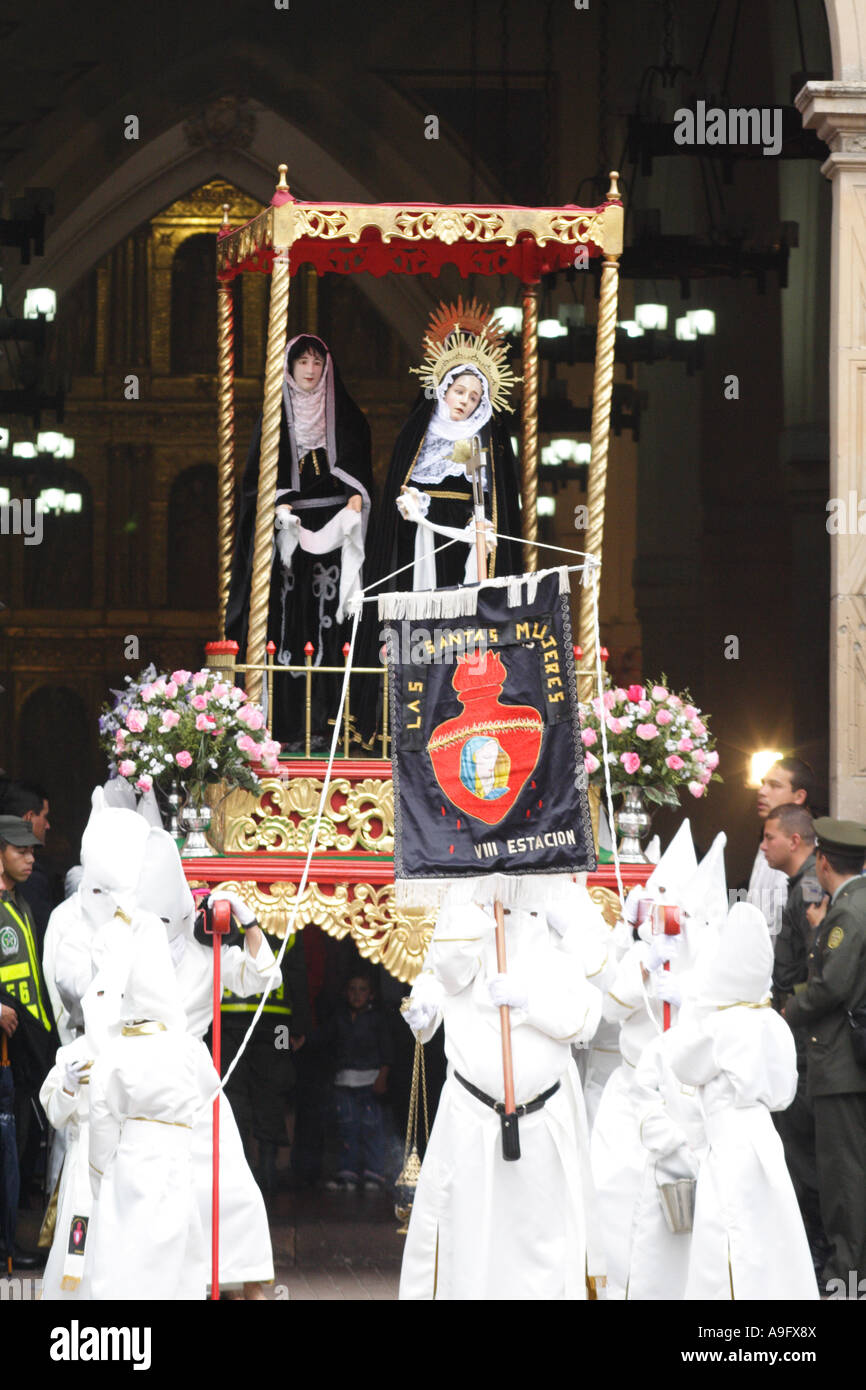 Group of men in penitence costume carrying a traditional religious ...
