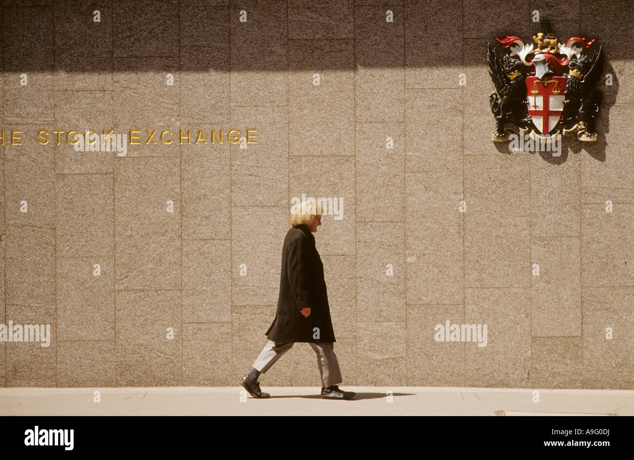 Tramp walking past the sign for the old london stck exchange Stock ...