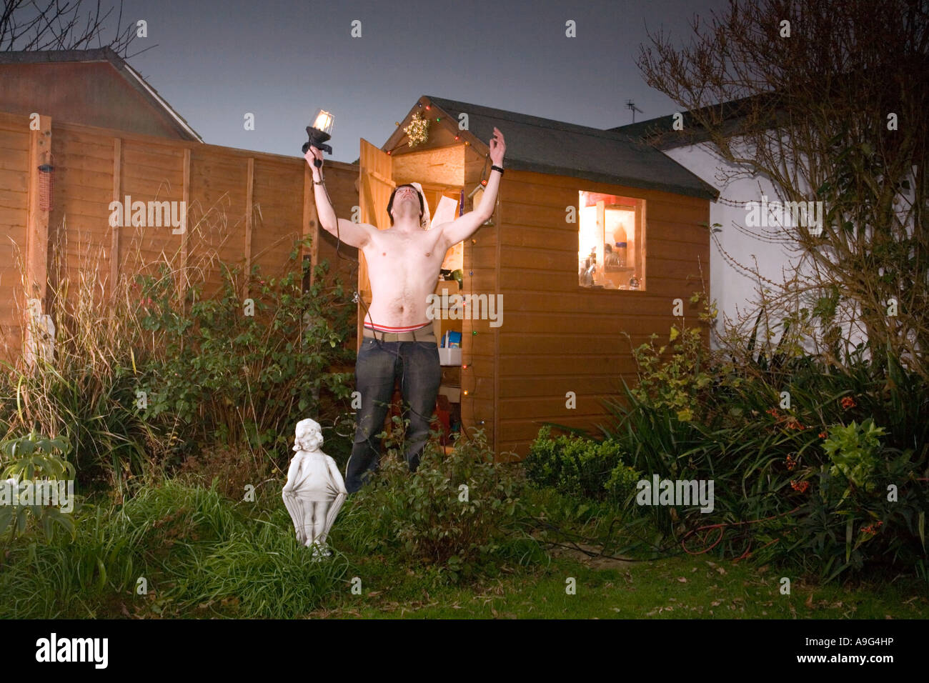 A crazy man screams into the night Stock Photo - Alamy