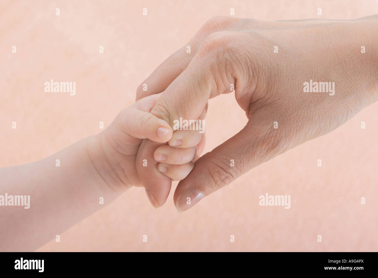 Baby grabbing adult finger hi-res stock photography and images - Alamy