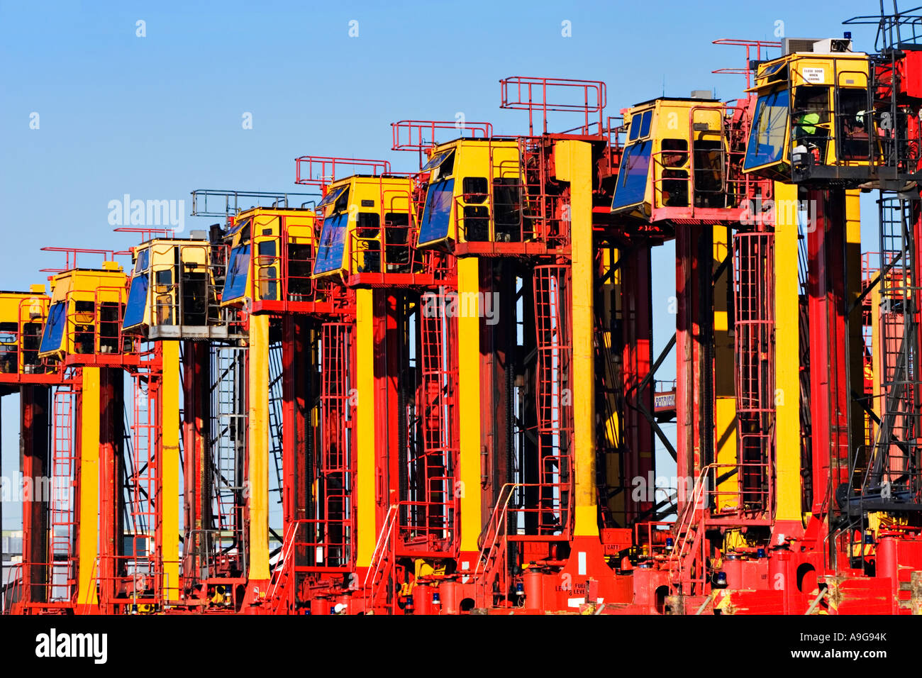 Shipping Industry / Container Straddle Carriers lined up on the docks ...