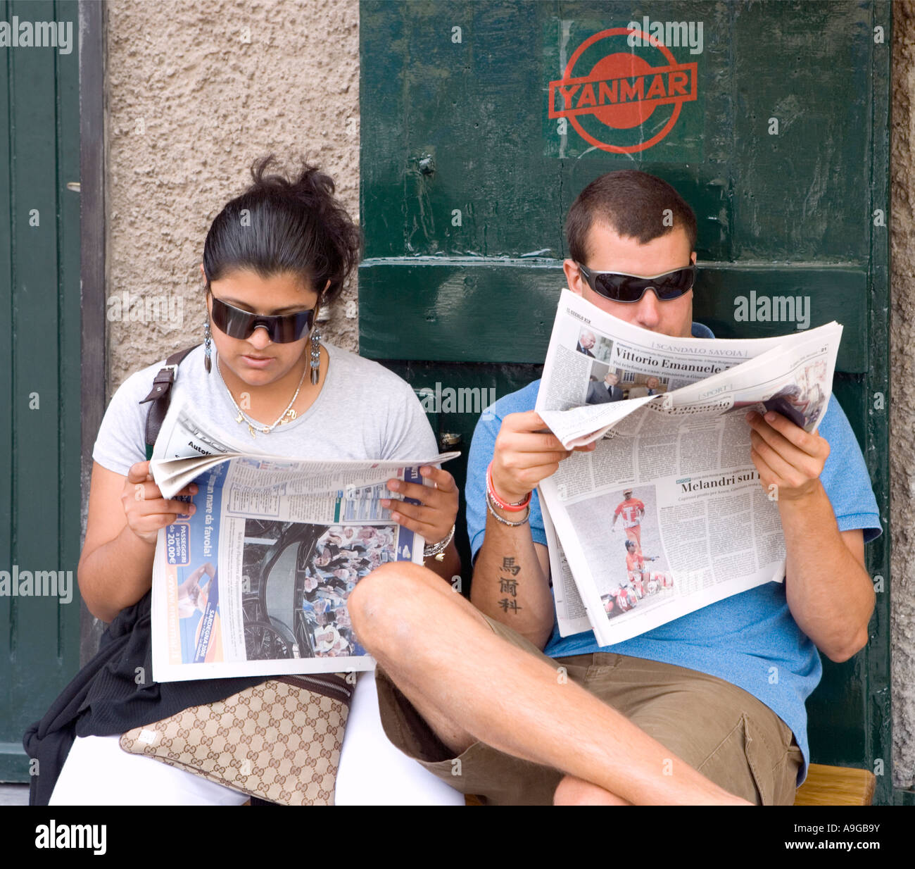 Reading newspapers Portofino Liguria Italy Stock Photo - Alamy