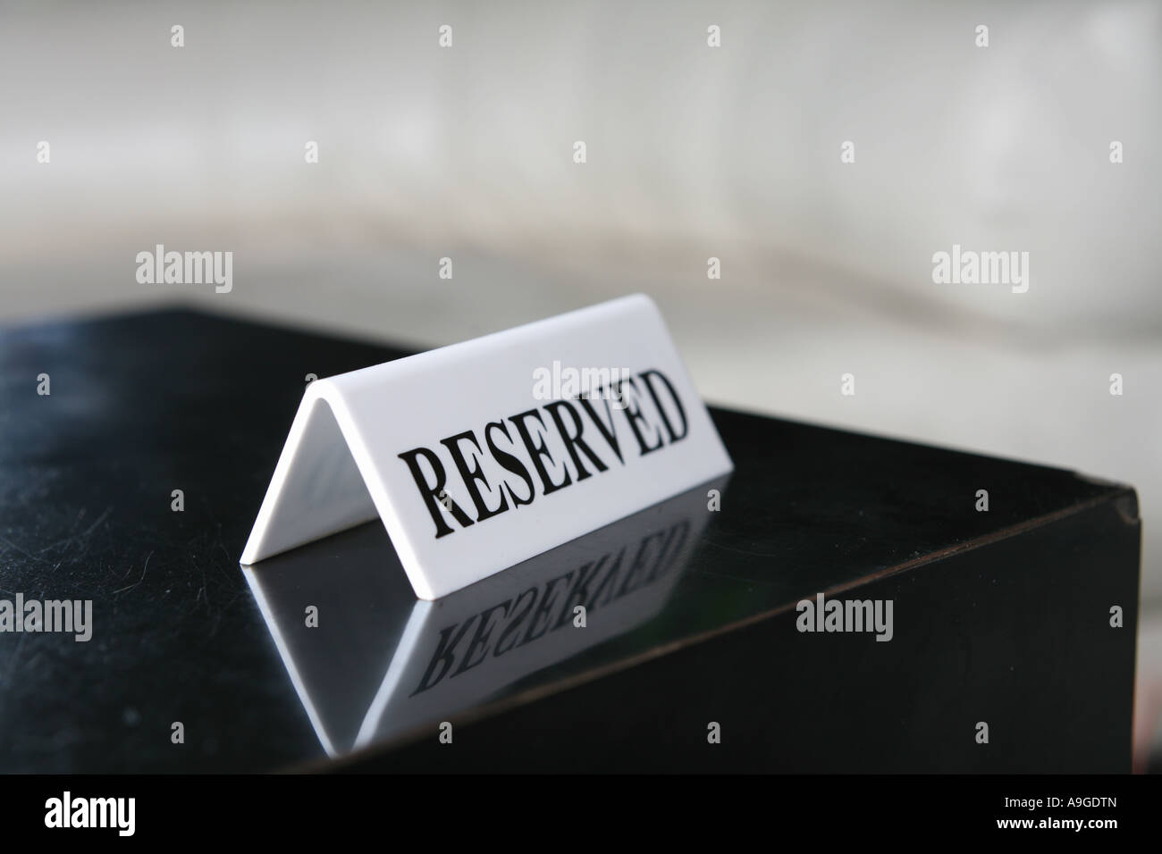 reserved sign on a bar table Stock Photo - Alamy