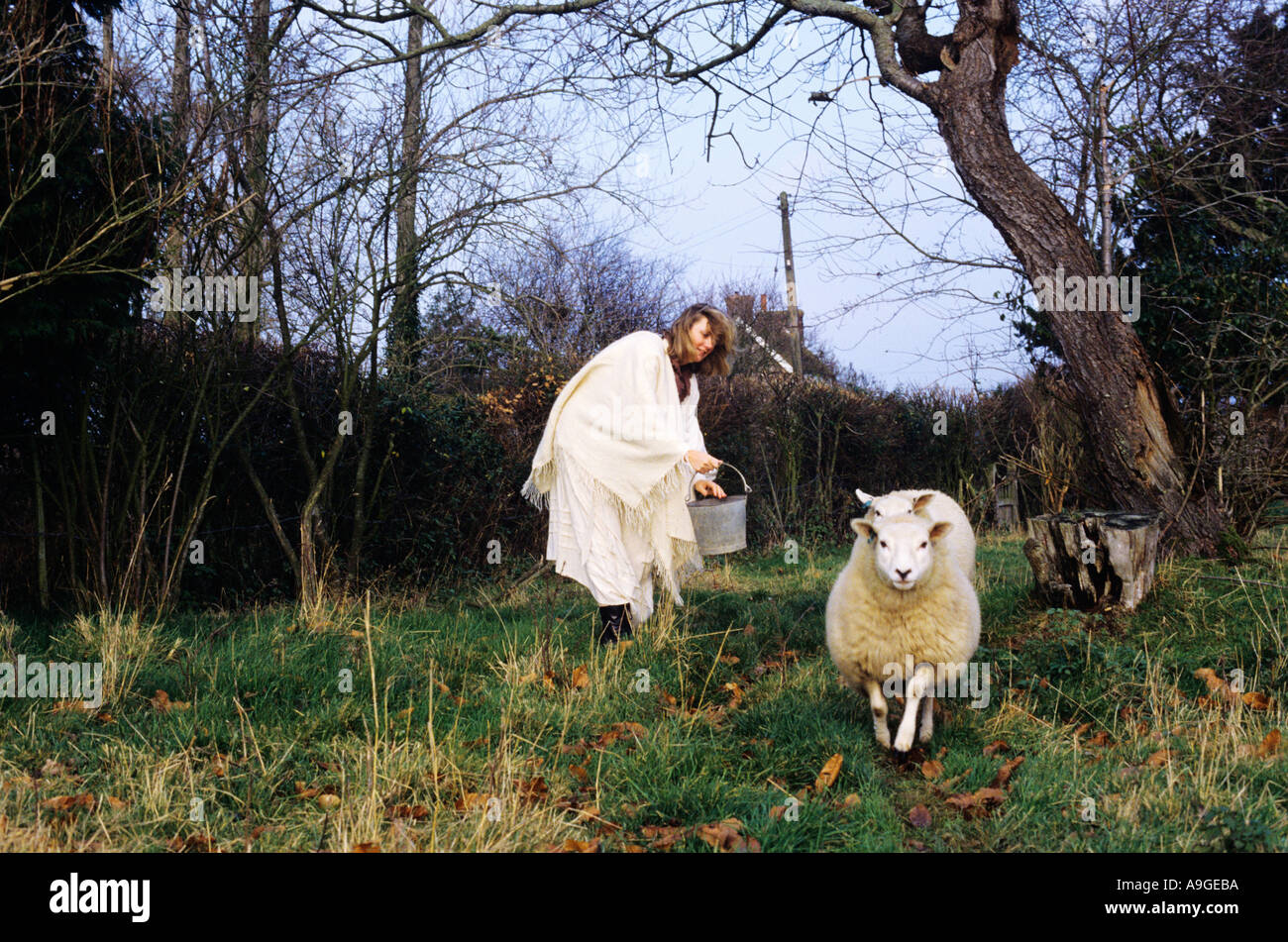 Wearing a Sussex smock whilst feeding the sheep Stock Photo - Alamy