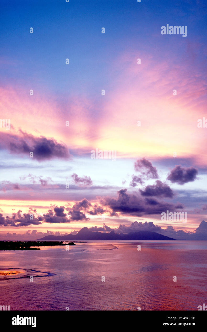 Sunset over the island of Moorea as seen from Tahiti in the Society ...