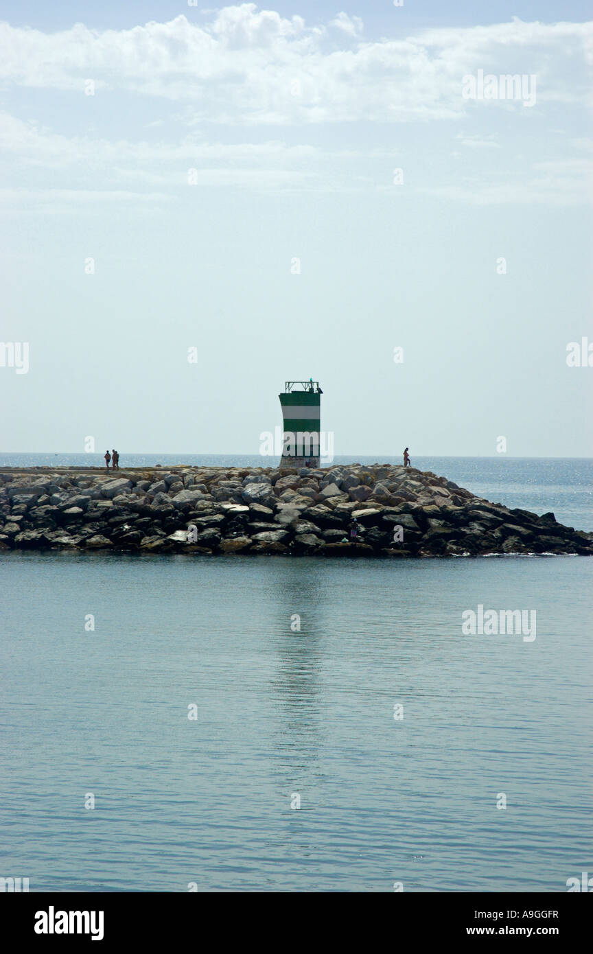 Harbour wall jetting out into the sea Stock Photo - Alamy
