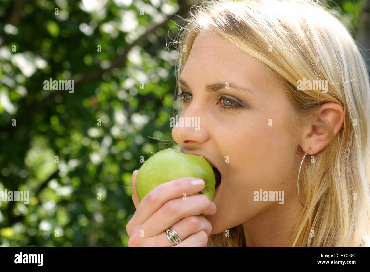 Closeup woman biting eating apple hi-res stock photography and images ...