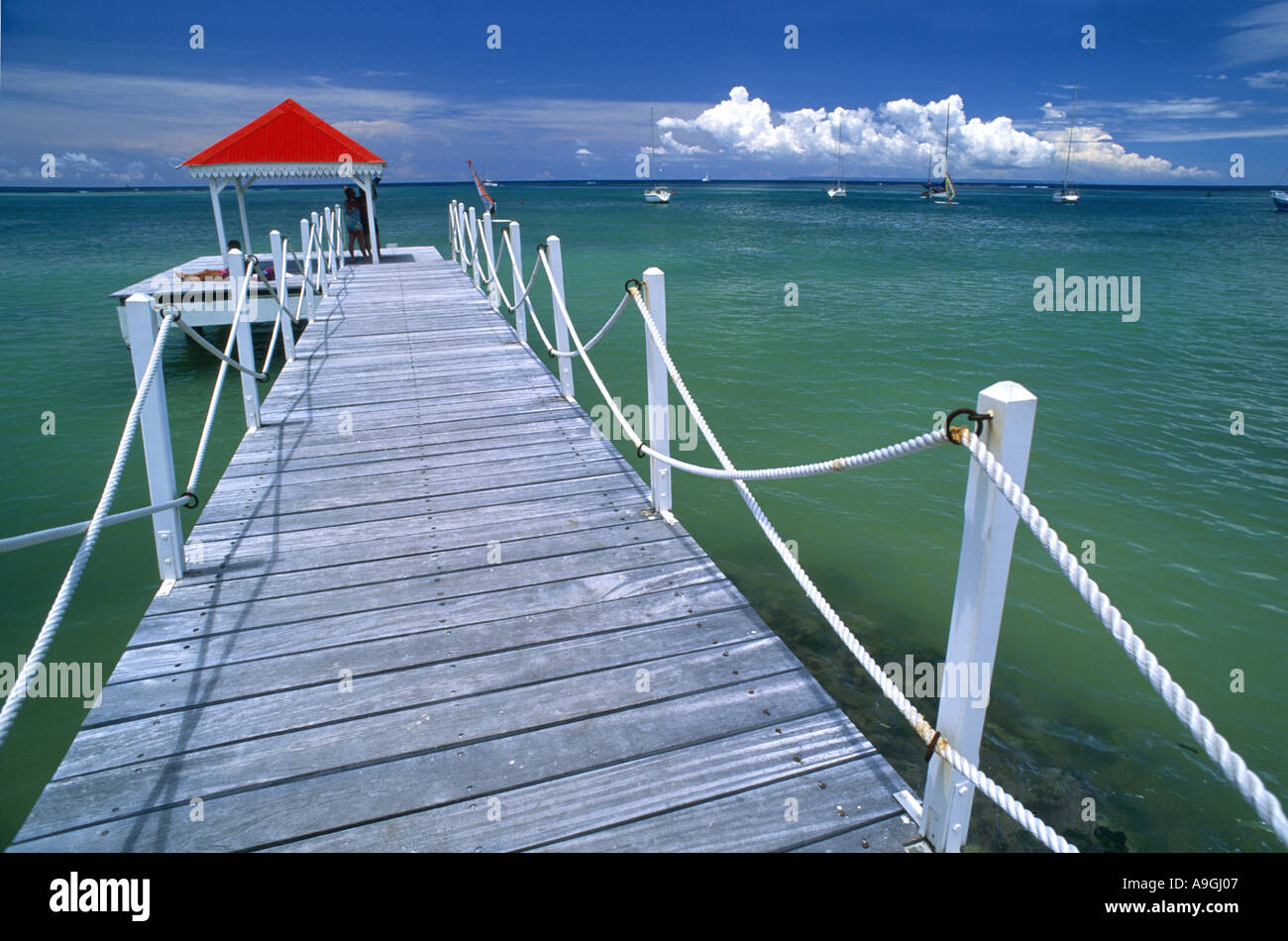 pier at Caribbean Ocean Stock Photo - Alamy