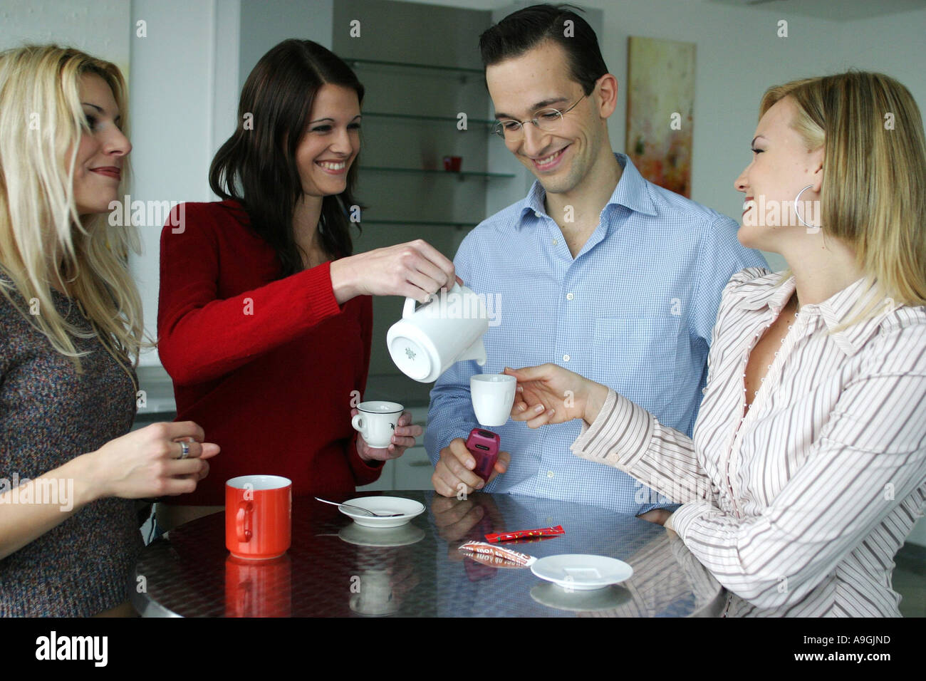 young office team drinking coffee Stock Photo - Alamy