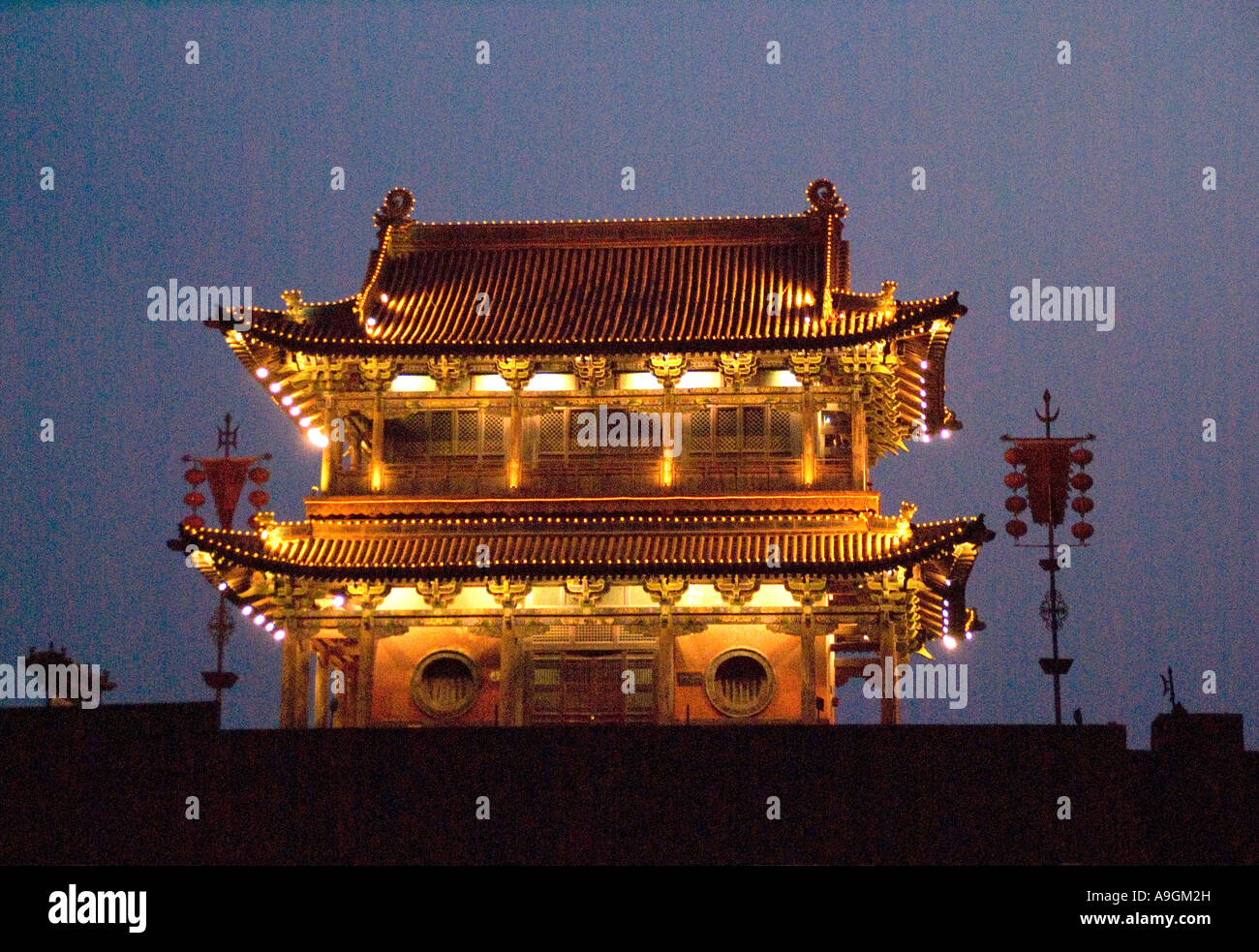 Pingyao watchtower at night on ancient rammed earth wall of 2700 year ...