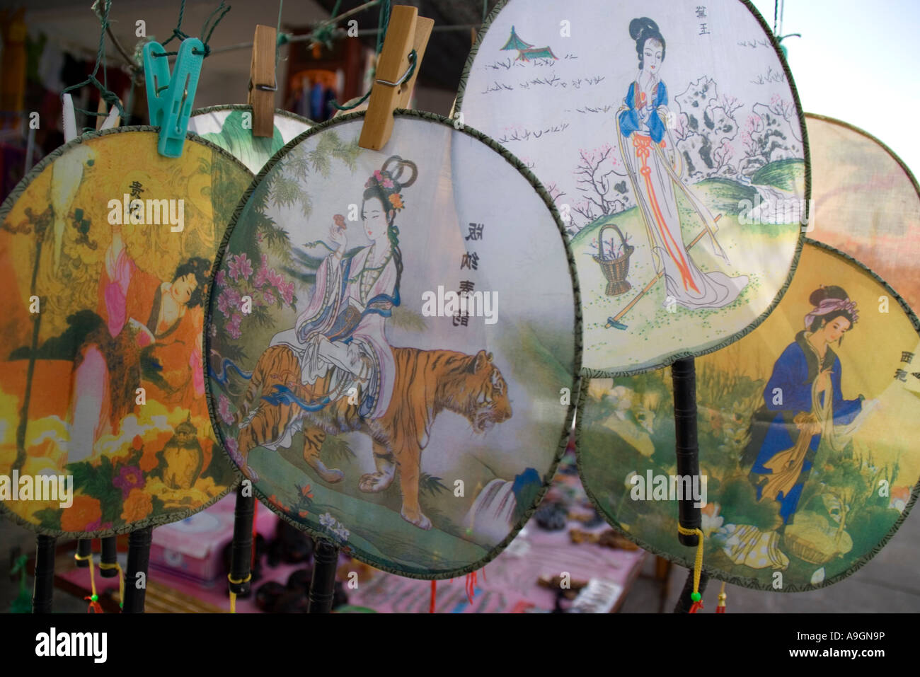 Decorative fans at shop on Golden Shuttle Jinsuo Dao Island in Lake ...