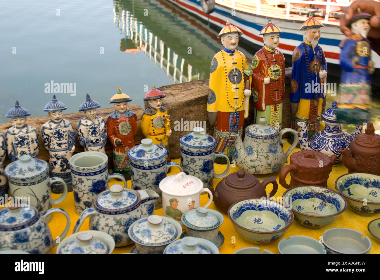 Porcelain figurines and dishware for sale on waterfront of Golden ...