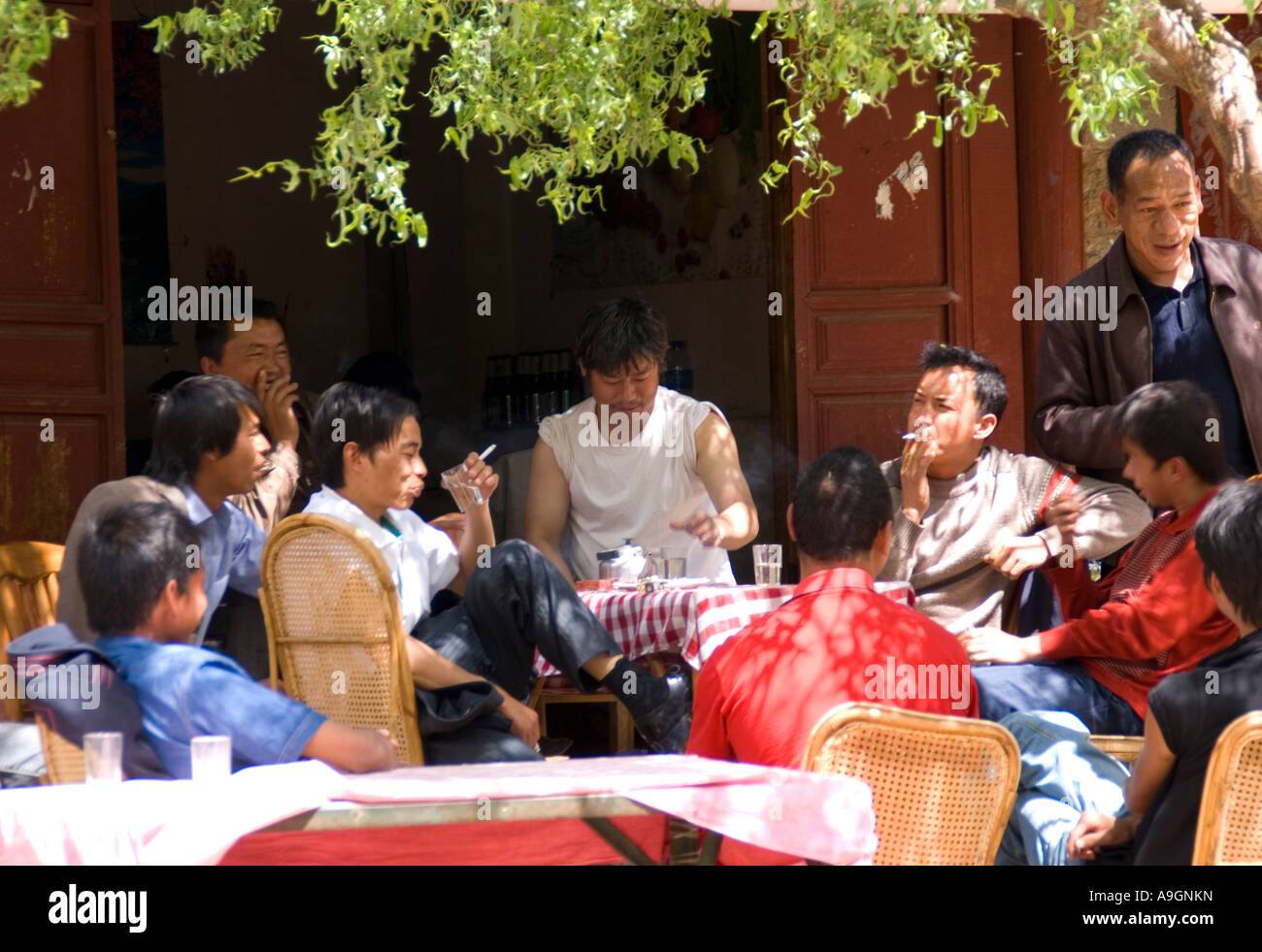 Chinese men smoking in baisha village hi-res stock photography and ...