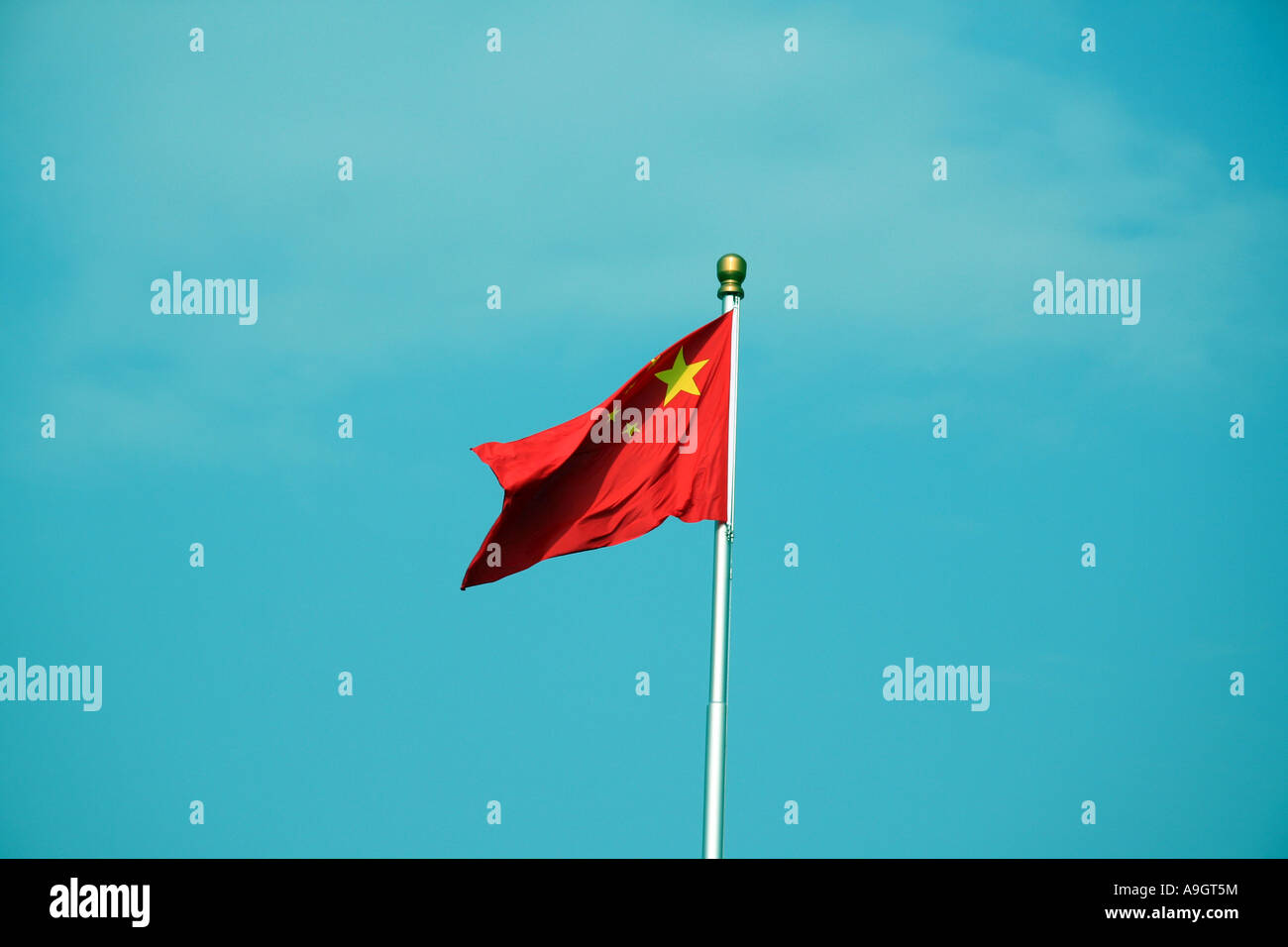 Chinese Flag on Blue Sky Stock Photo - Alamy