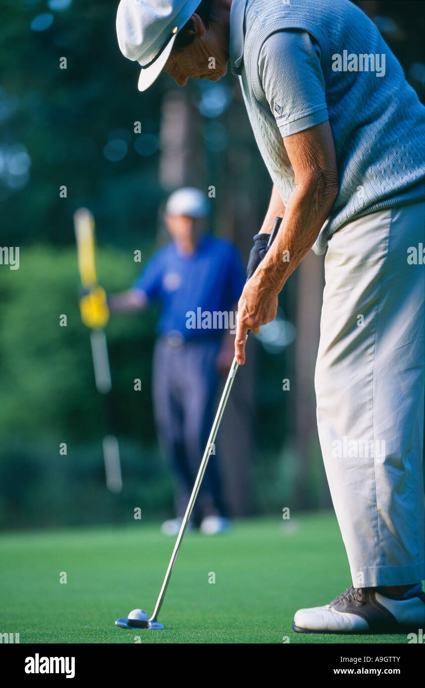 golfer putting model released Surrey England UK Stock Photo - Alamy