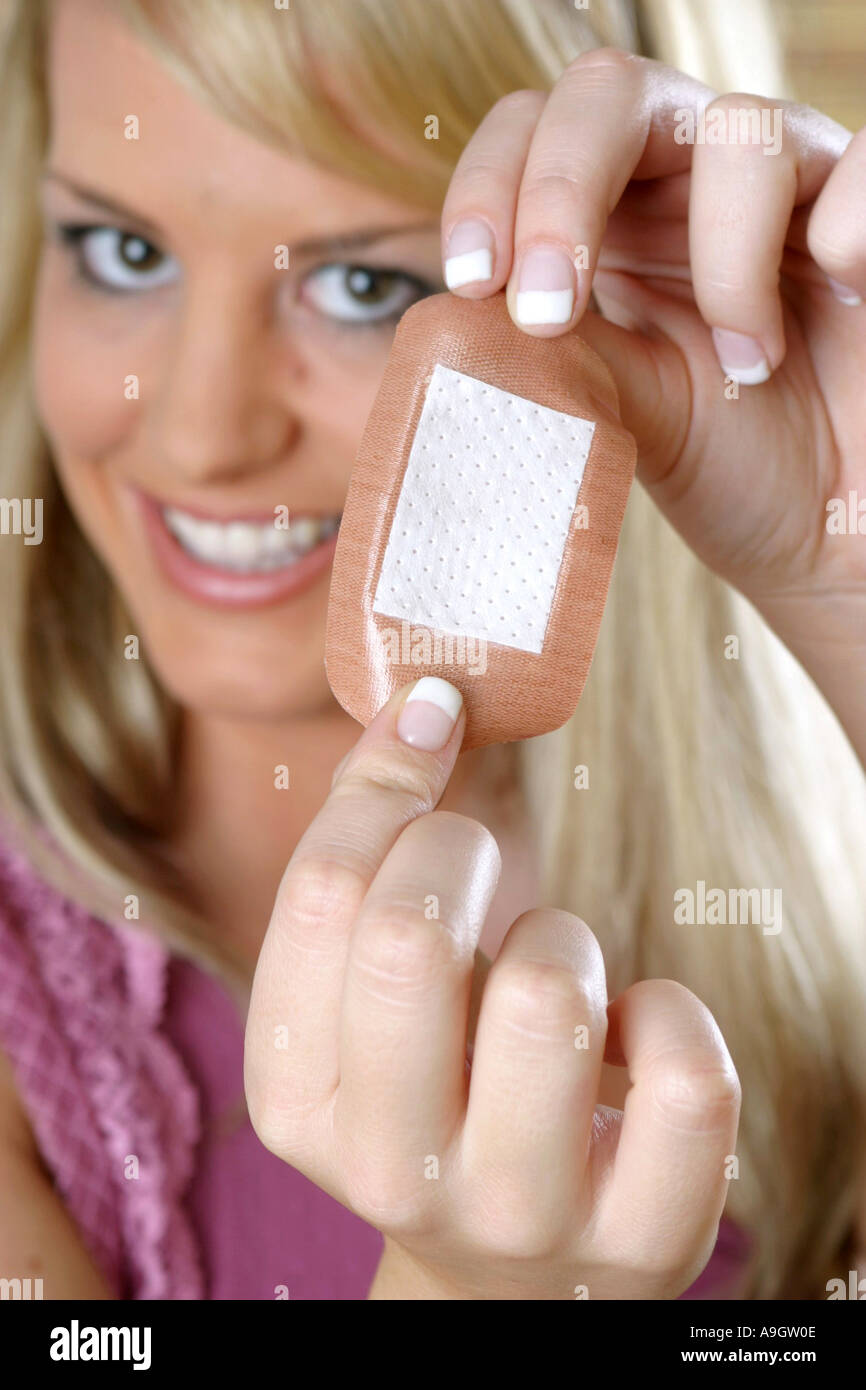 woman holding adhesive plaster Stock Photo - Alamy