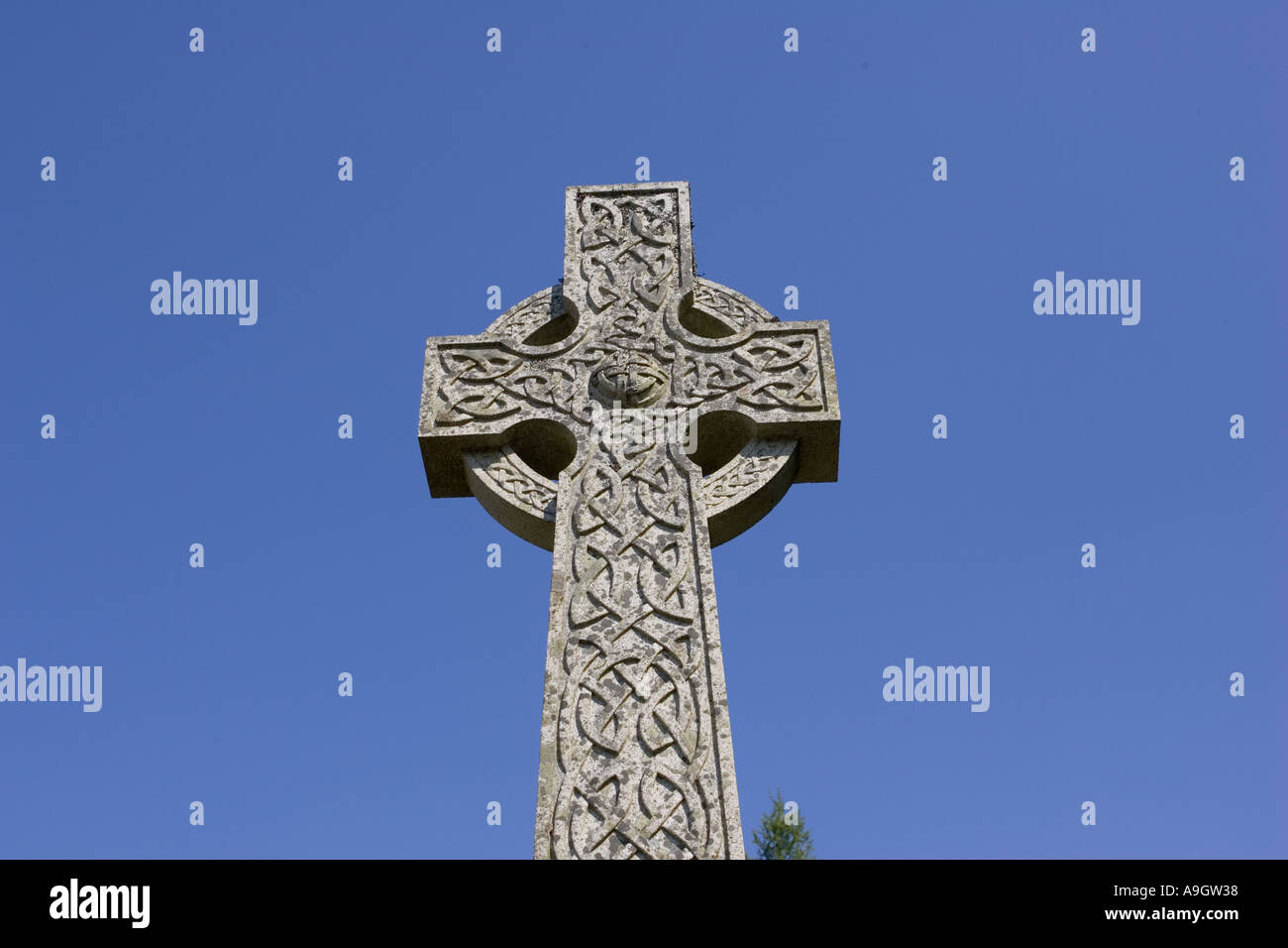 Celtic cross against deep blue sky Glencoe near Fort William Scotland ...