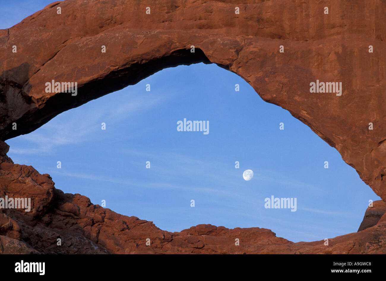 Moon seen through window in desert rock Stock Photo - Alamy