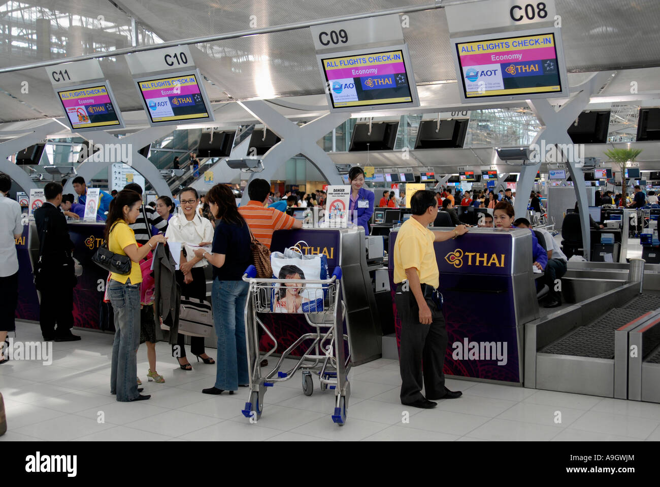 Checkin counters at Bangkok International Airport, Suvarnabhumi Thailand Stock Photo - Alamy
