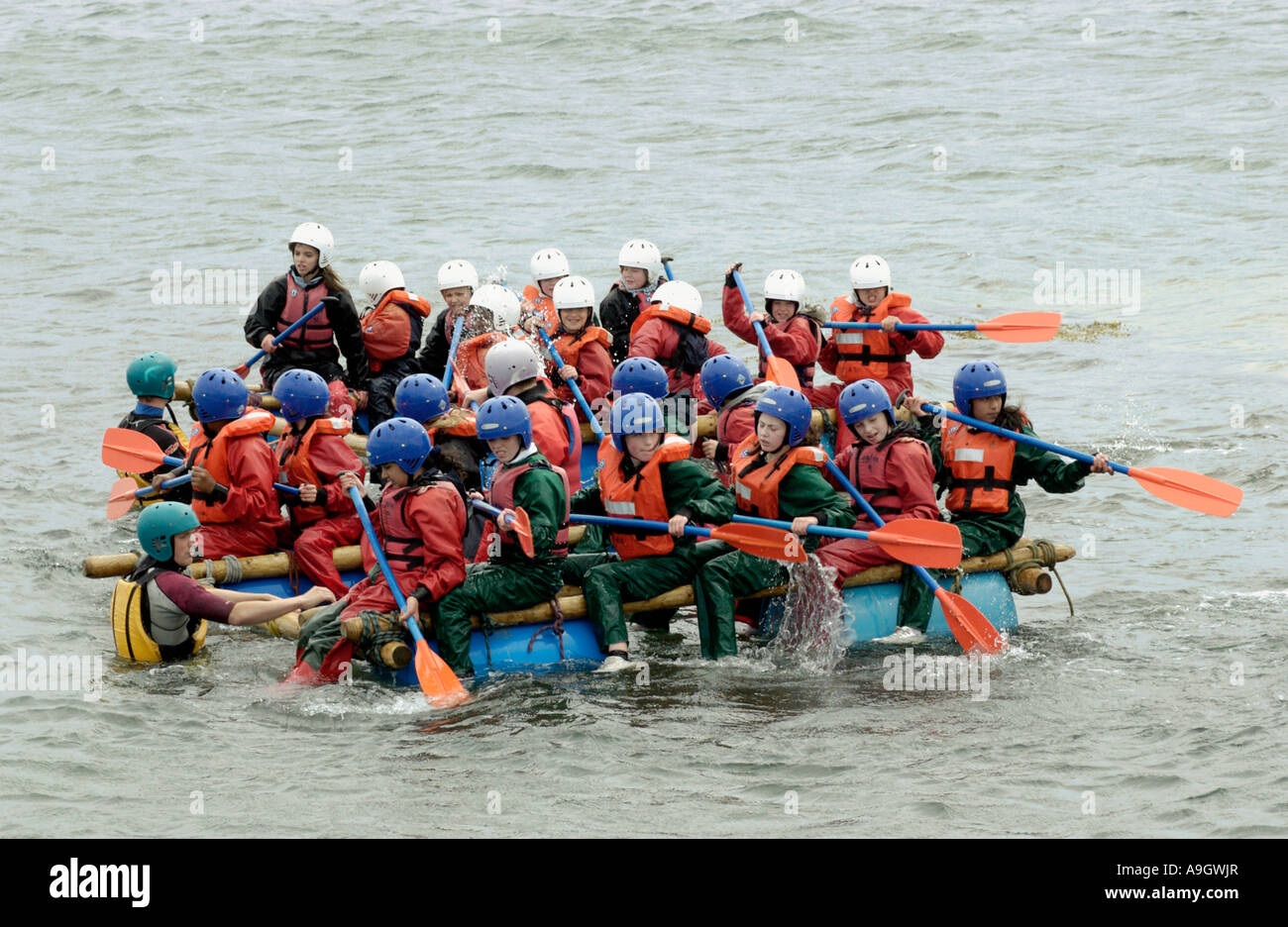 School children learn teamwork skills raft race Stock Photo - Alamy