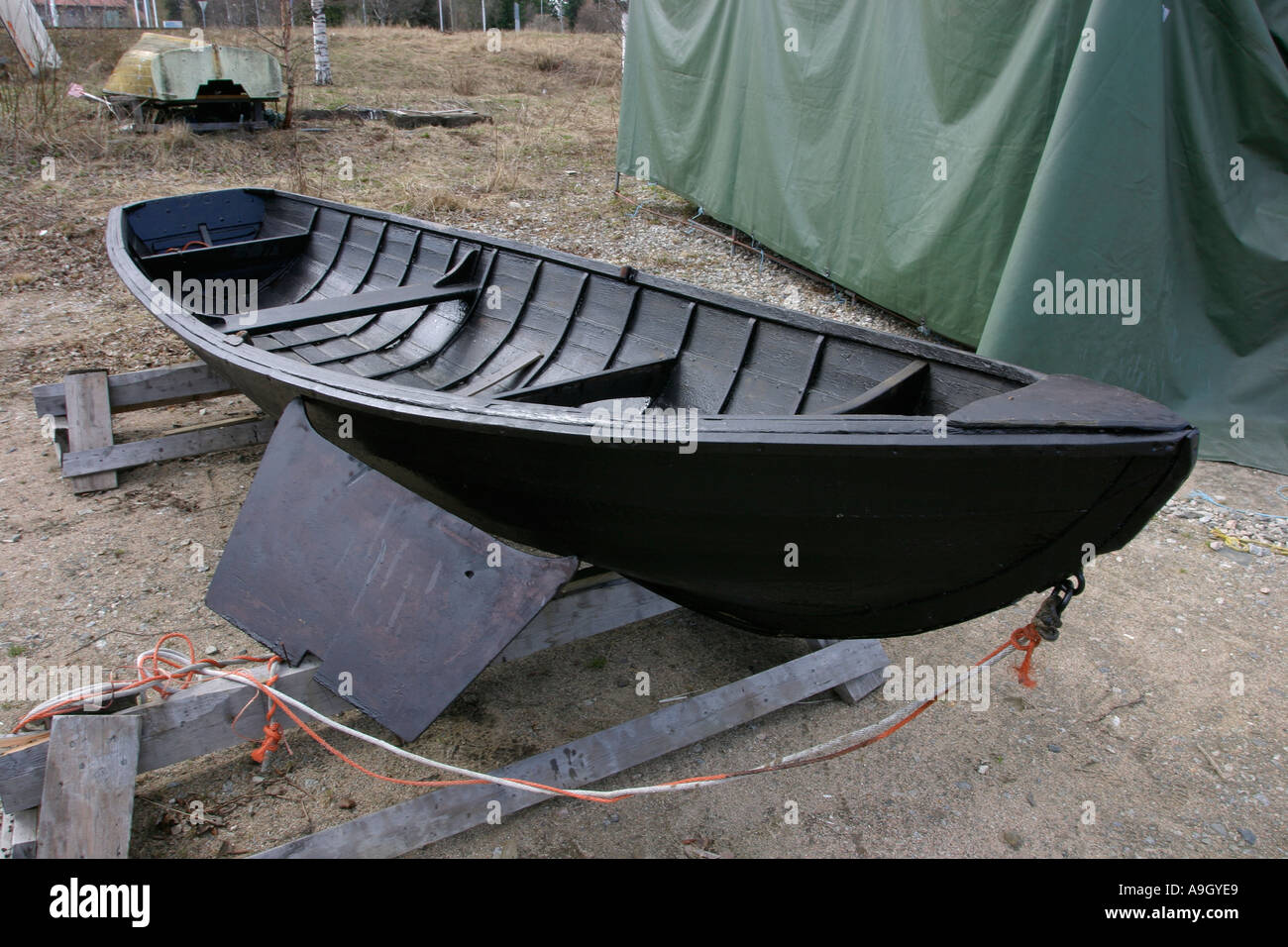 tar covered boat Stock Photo - Alamy