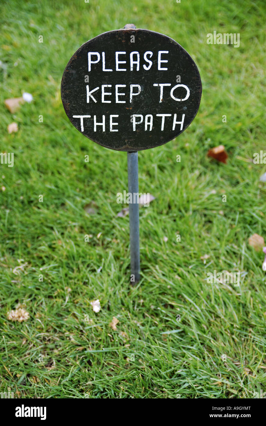 Sign stating 'Please keep to the path' Stock Photo - Alamy