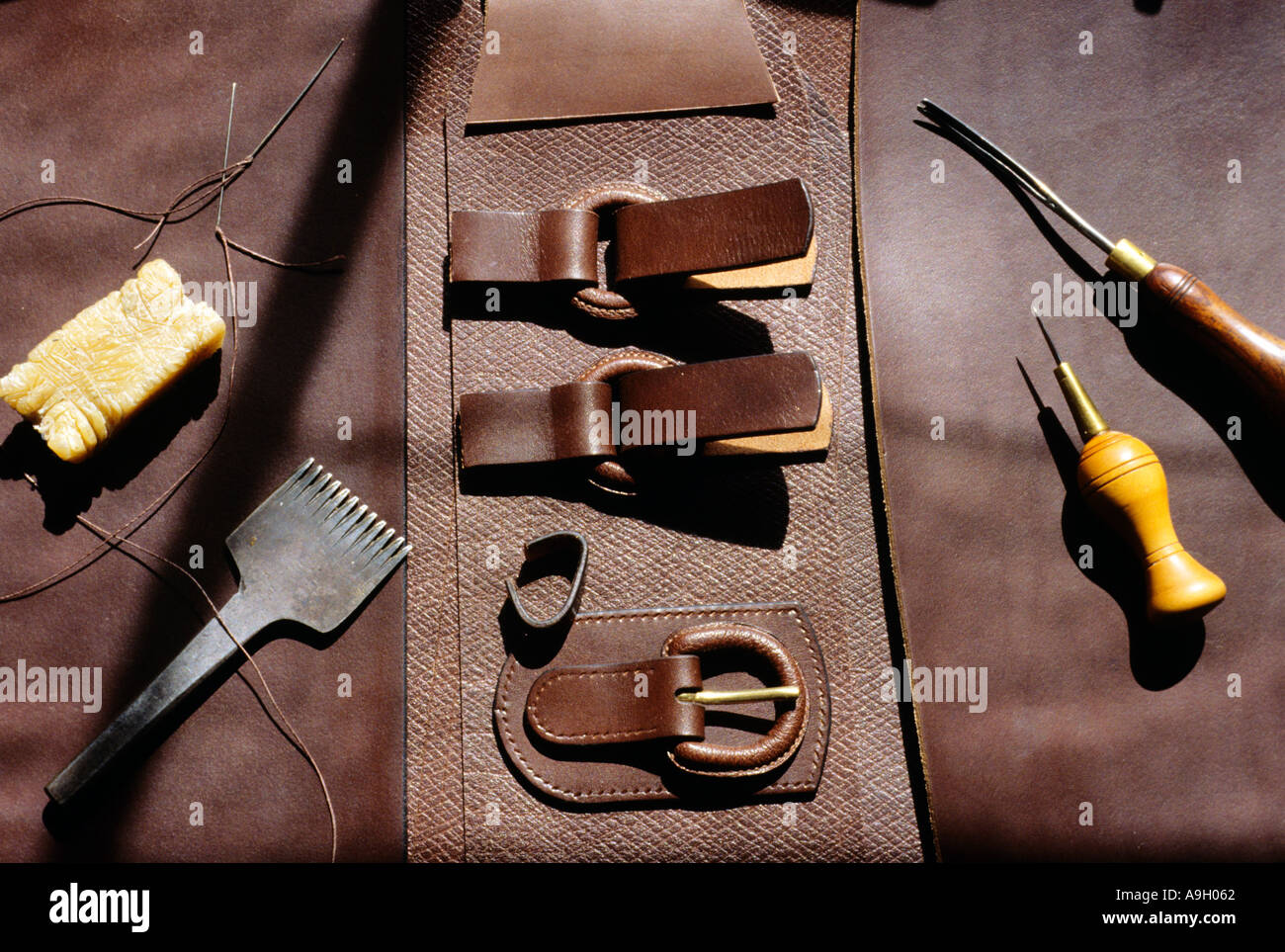 Buckles loops waxed thread and hole punches Stock Photo - Alamy
