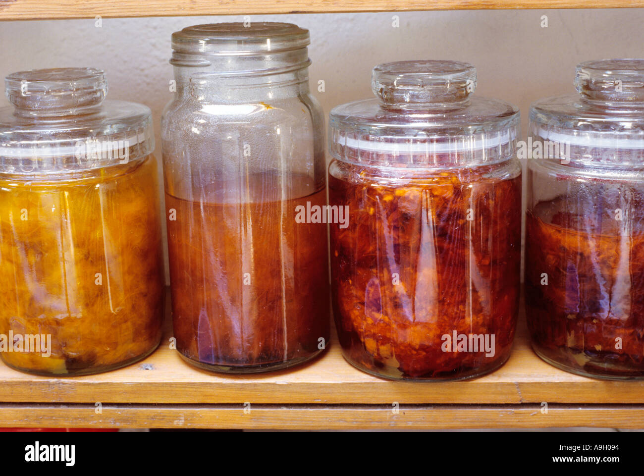 Handmade paper jars of rusty orange coloured paper pulp Stock Photo - Alamy